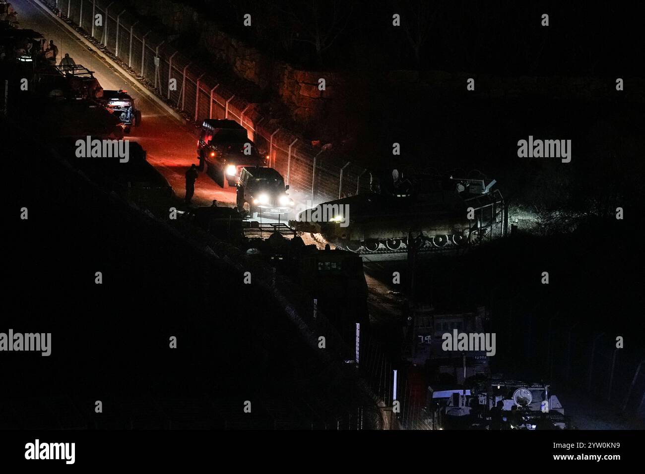 An Israeli army tank maneuvers along the so-called Alpha Line that ...