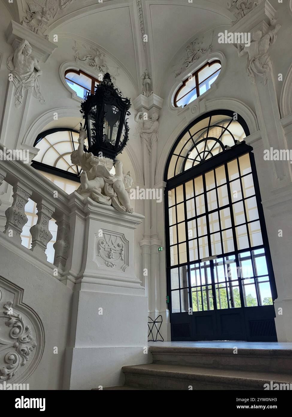 Elegant Baroque Staircase With Ornate Details and Large Arched Windows ...