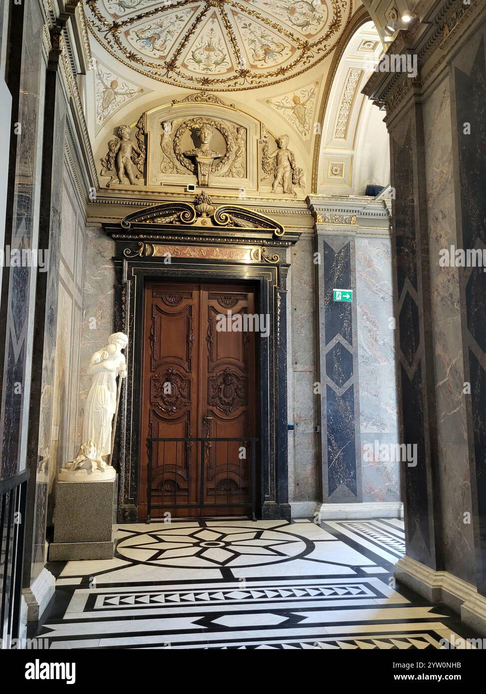Intricate Architectural Hallway with Wooden Door and Marble Statue at ...