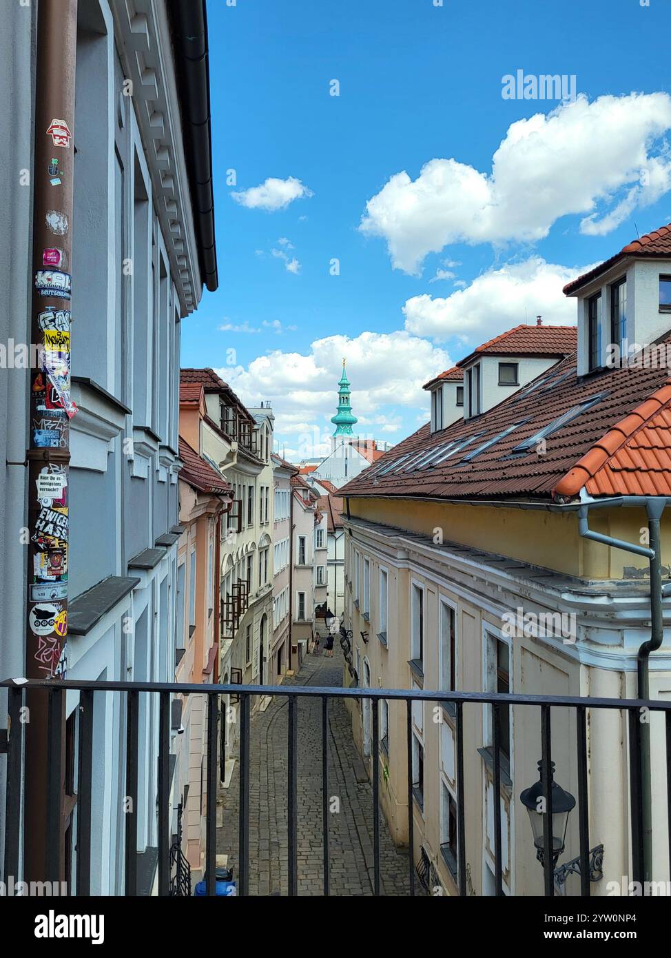 Charming European Alleyway with Historic Buildings Under Blue Sky Stock ...