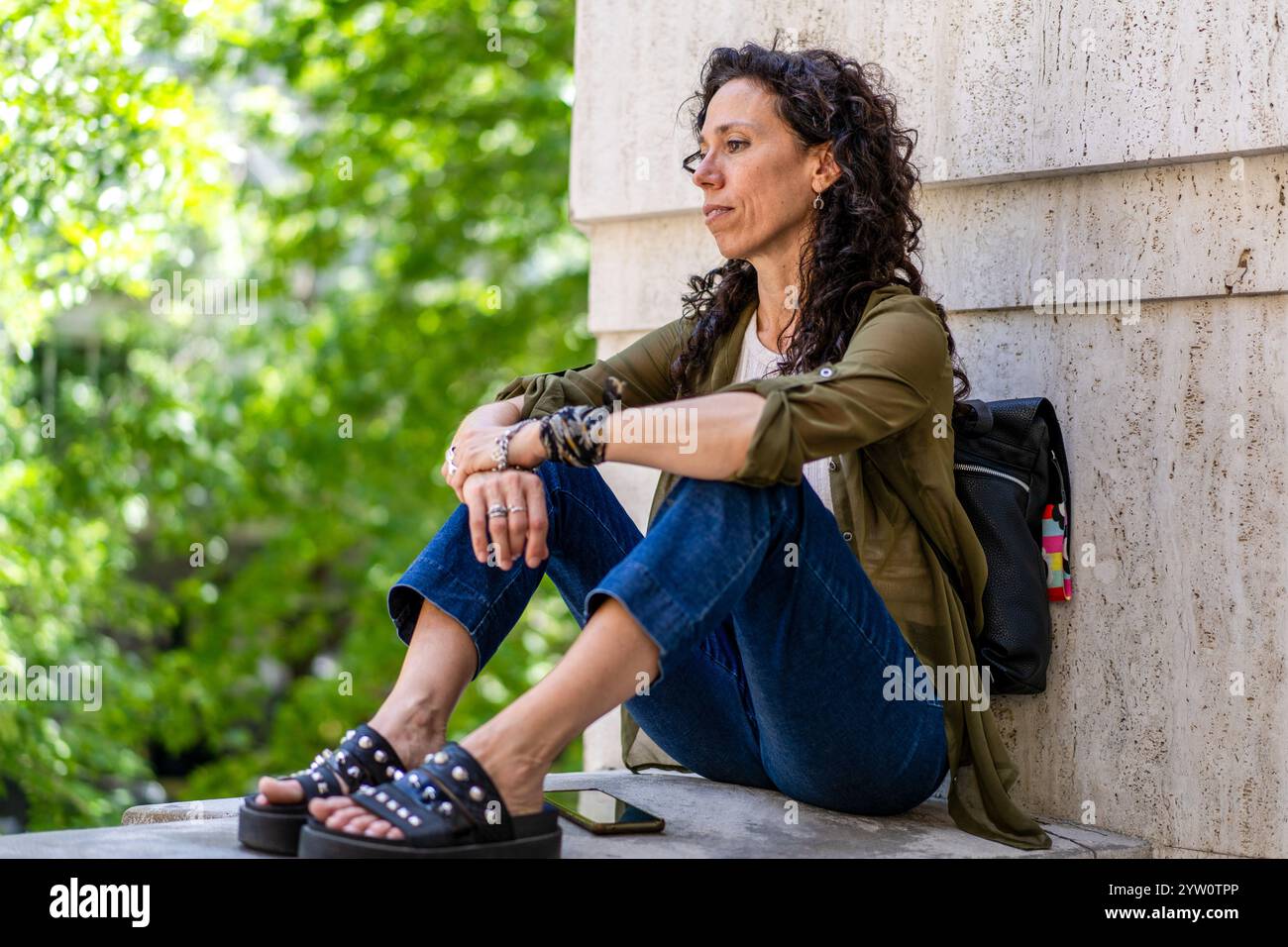 Woman leisurely sitting on hi-res stock photography and images - Alamy