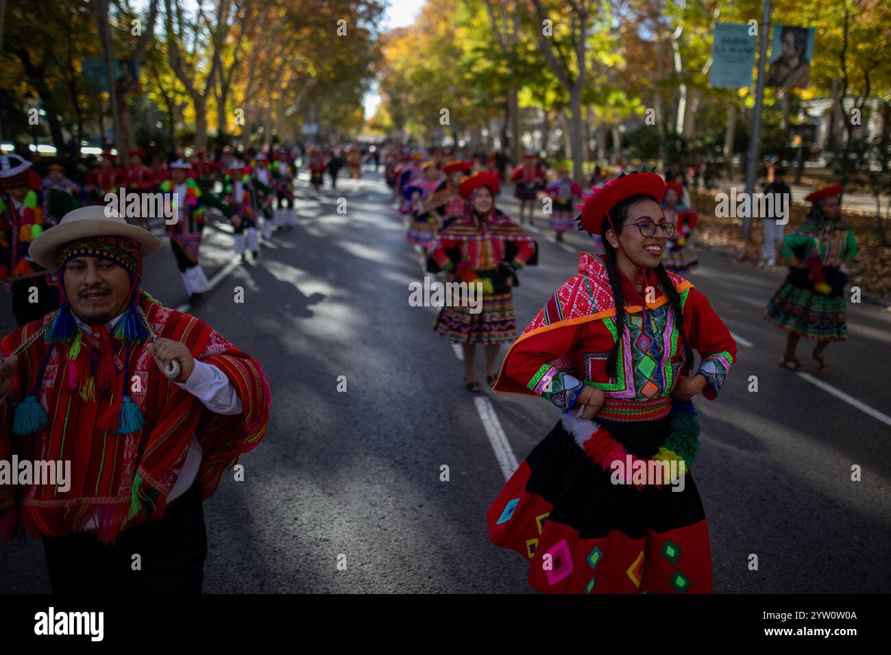 Madrid, Spain. 08th Dec, 2024. A group of women in traditional Peruvian ...