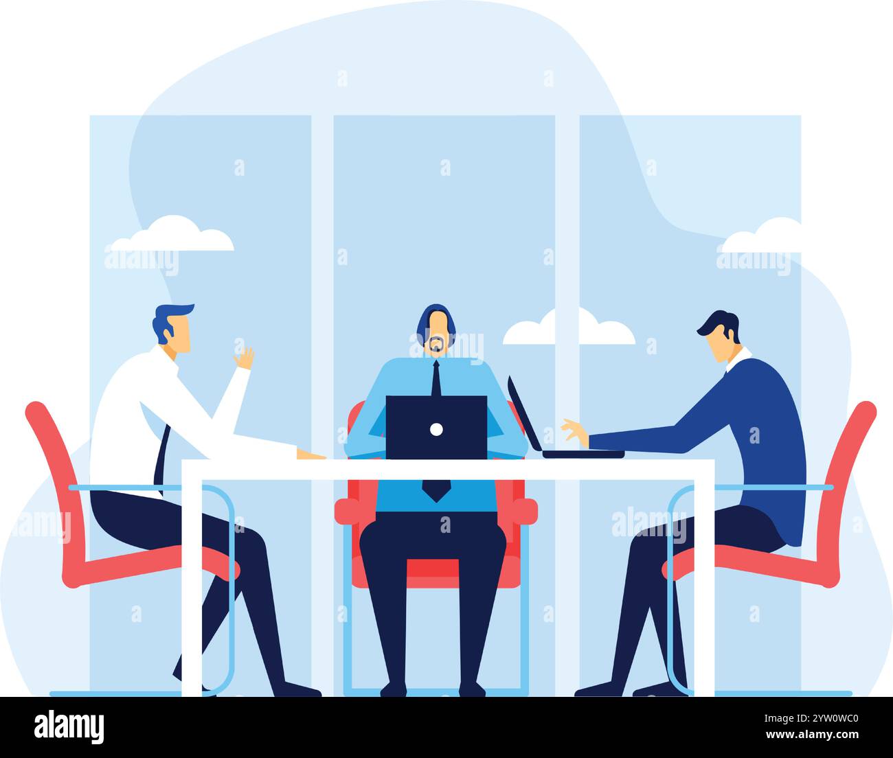 Office workers using laptops and discussing projects at meeting table ...