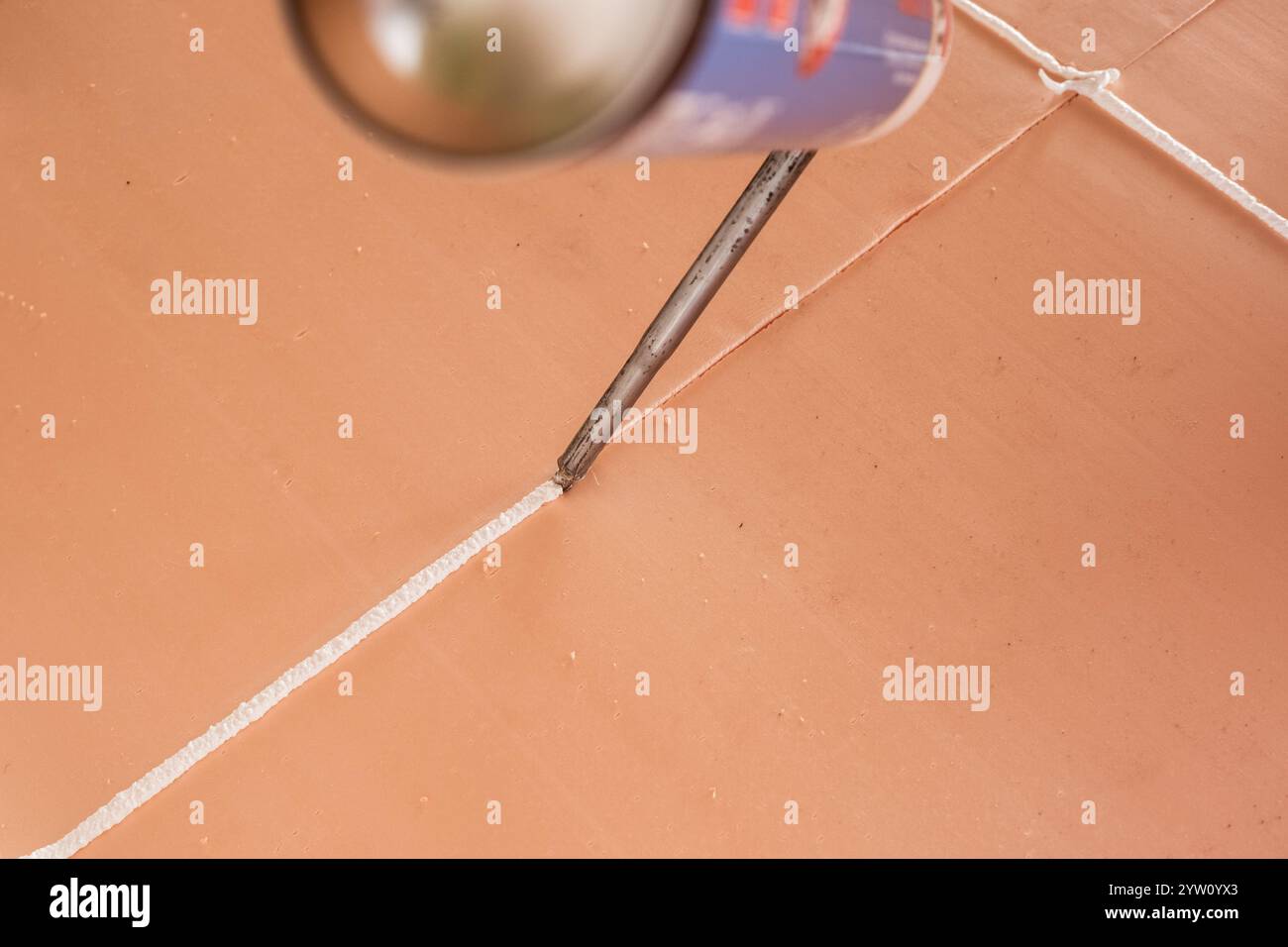 Sealing the seams of polyurethane slabs with mounting foam from a can ...