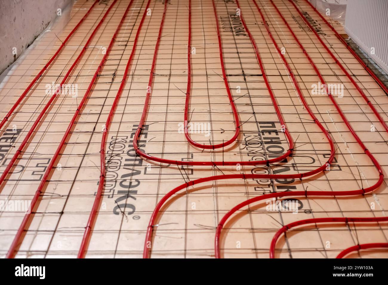 Installation of underfloor heating. Pipes for underfloor heating made of cross-linked ...