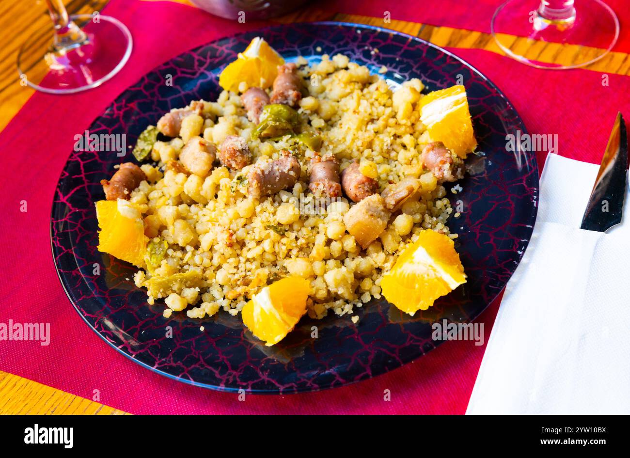Typical spanish dish from semolina flour with longaliza sausage Stock ...