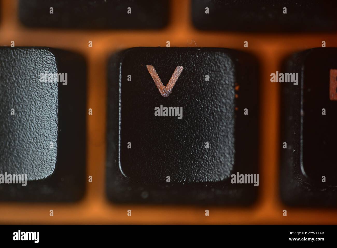 RGB backlit keyboard. Close-up of the letter 'V' Key Stock Photo - Alamy