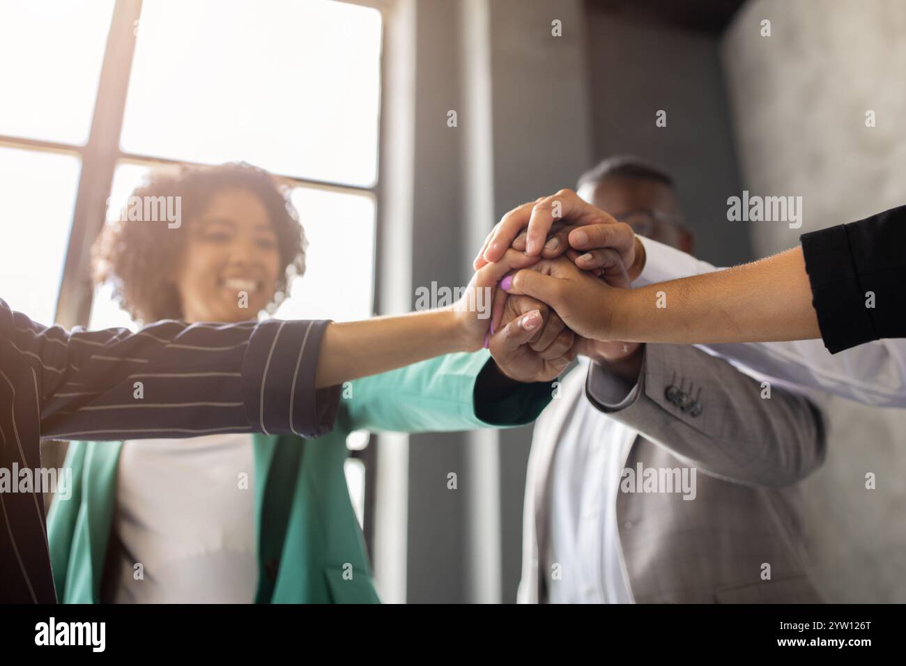Team celebrating success in a diverse corporate environment Stock Photo ...