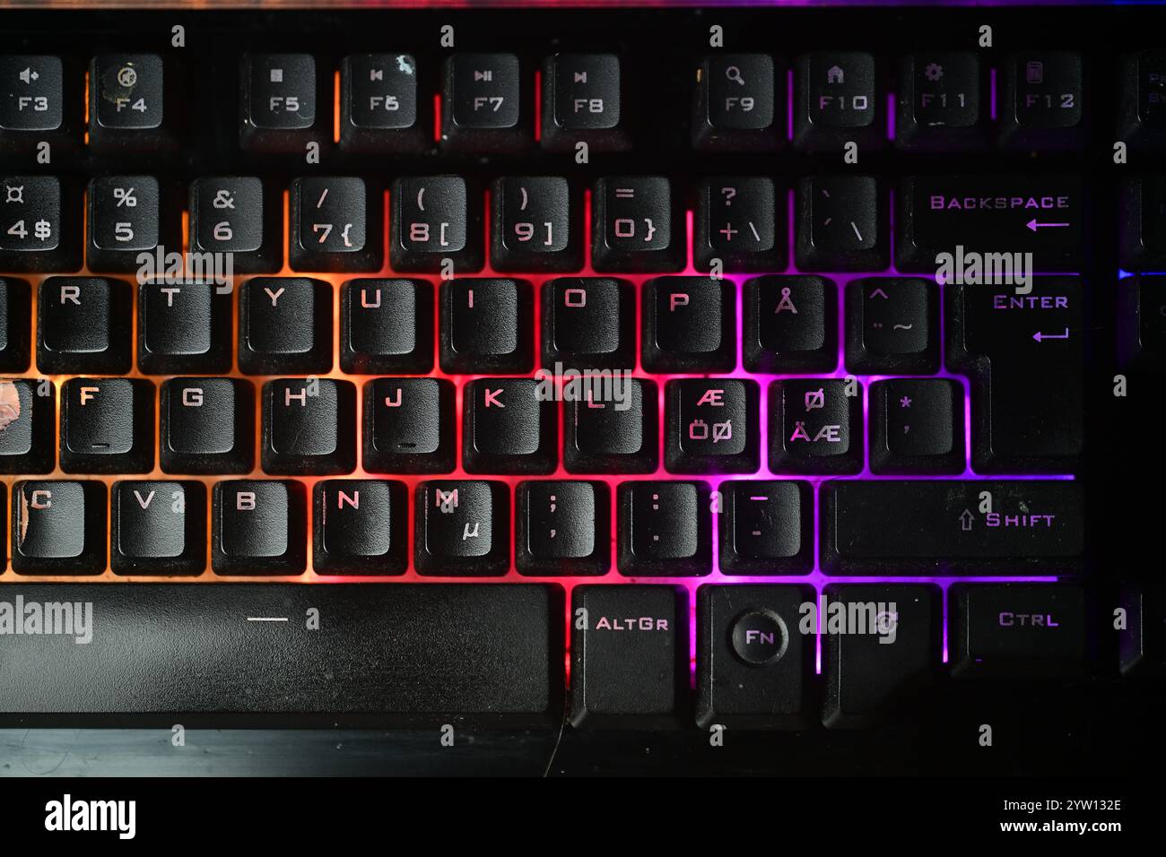 Black RGB backlit keyboard on a desk Stock Photo - Alamy