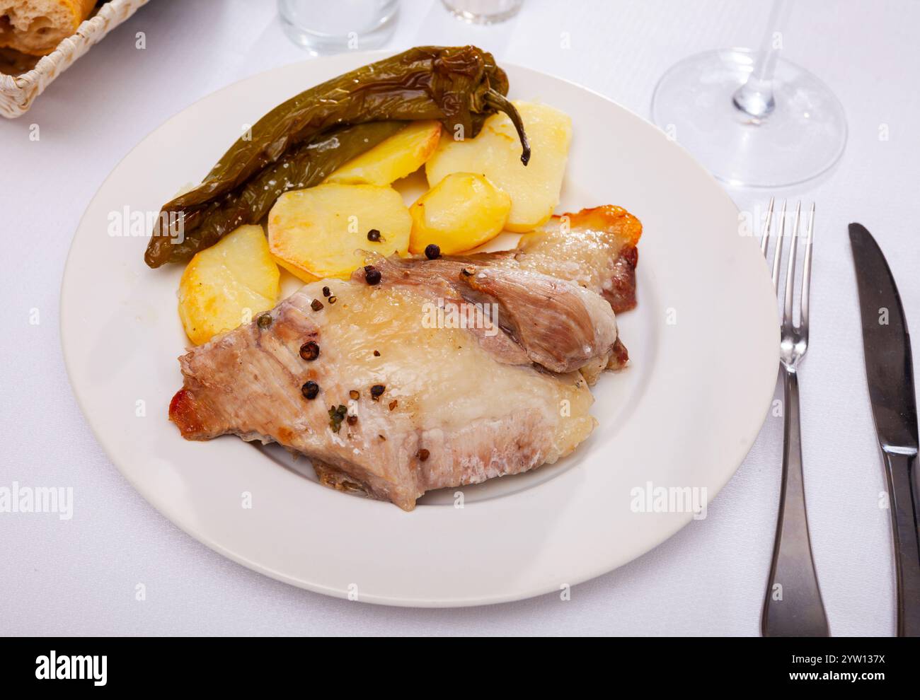 Fried Iberian pig served with potatoes, parsley, stewed pepper Stock ...