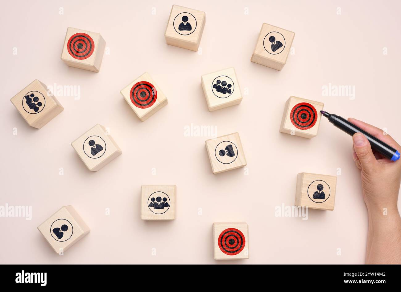 Wooden cubes with staff and goals, search for target audience, top view ...