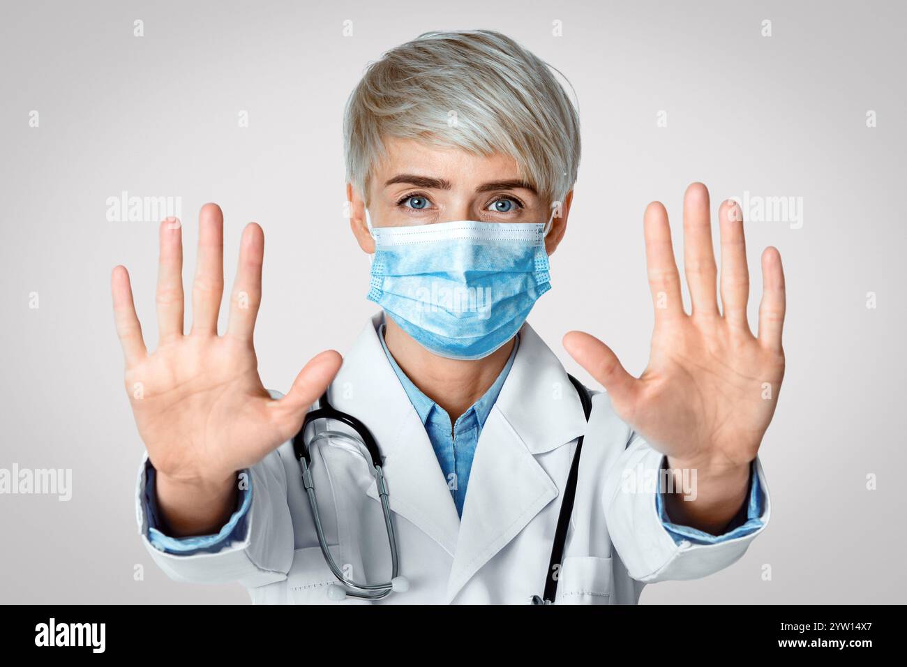 Stop disease concept. Doctor holds out her hands forward Stock Photo ...