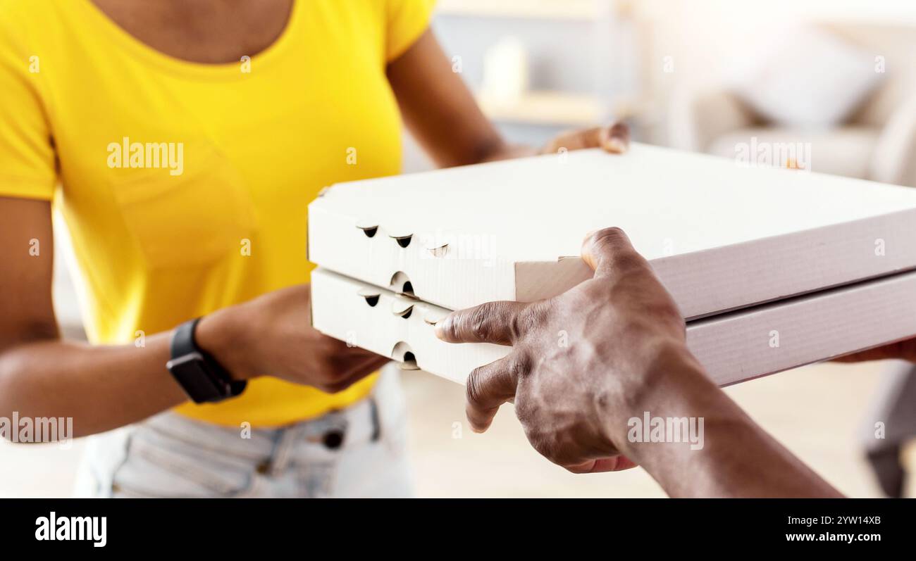 Cropped shot woman giving package hi-res stock photography and images ...