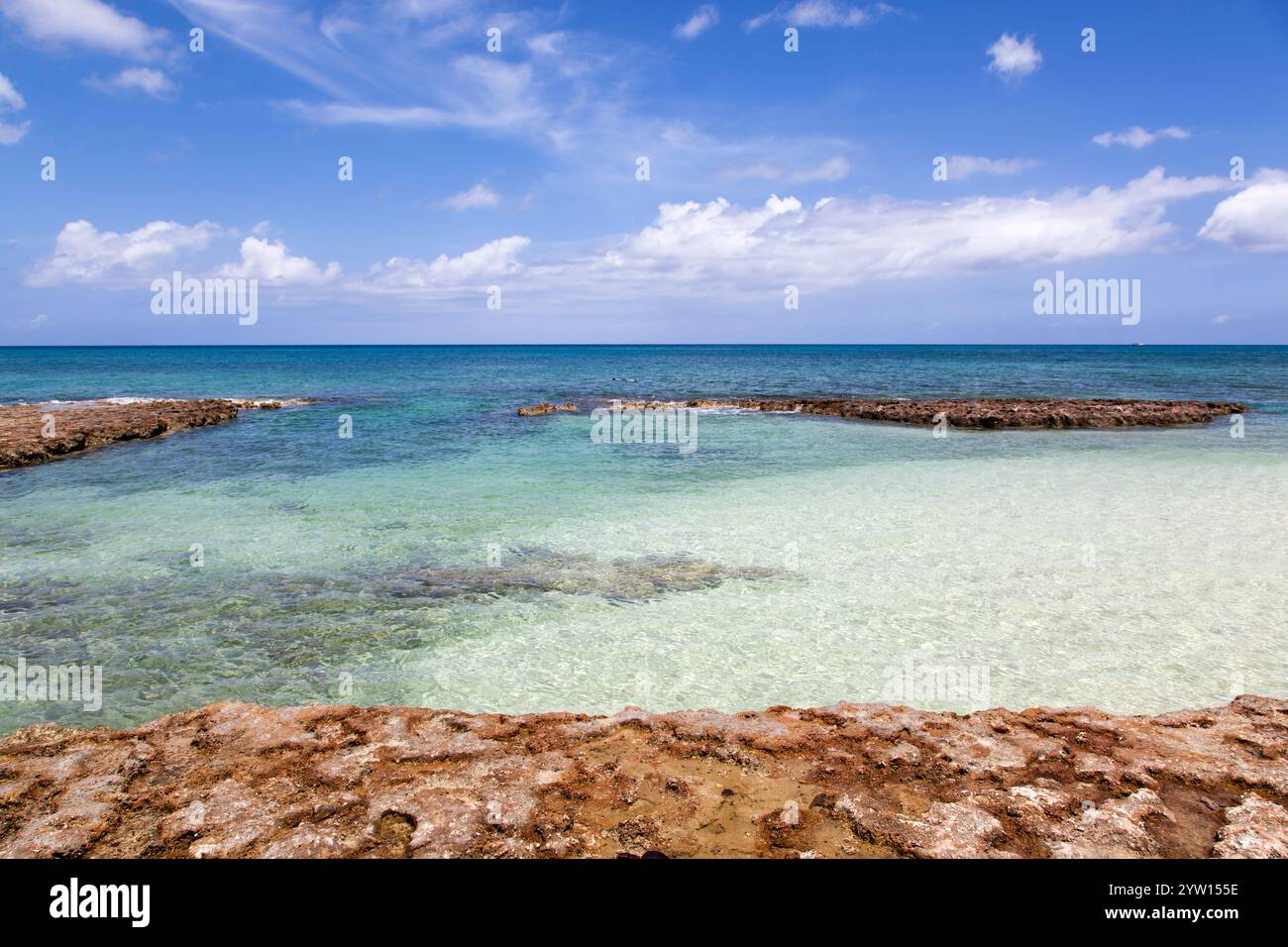 The natural pool little inlet surrounded by rocks on Grand Cayman ...