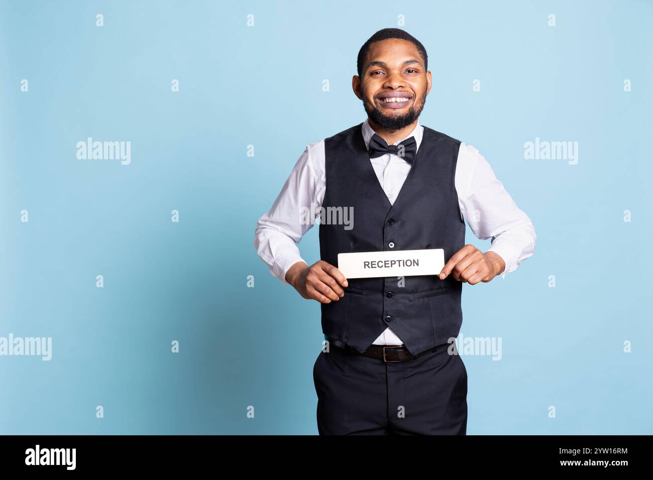 Hotel concierge staff showing the reception indicator at front desk ...