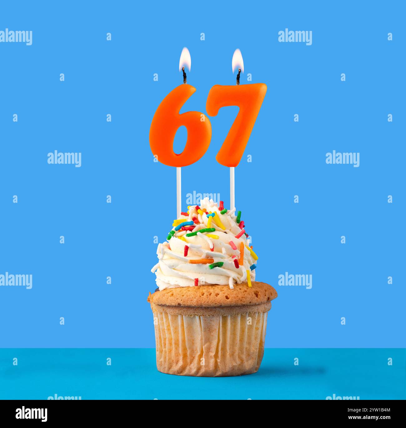 Orange birthday candle and cupcake - Number 67 Stock Photo - Alamy
