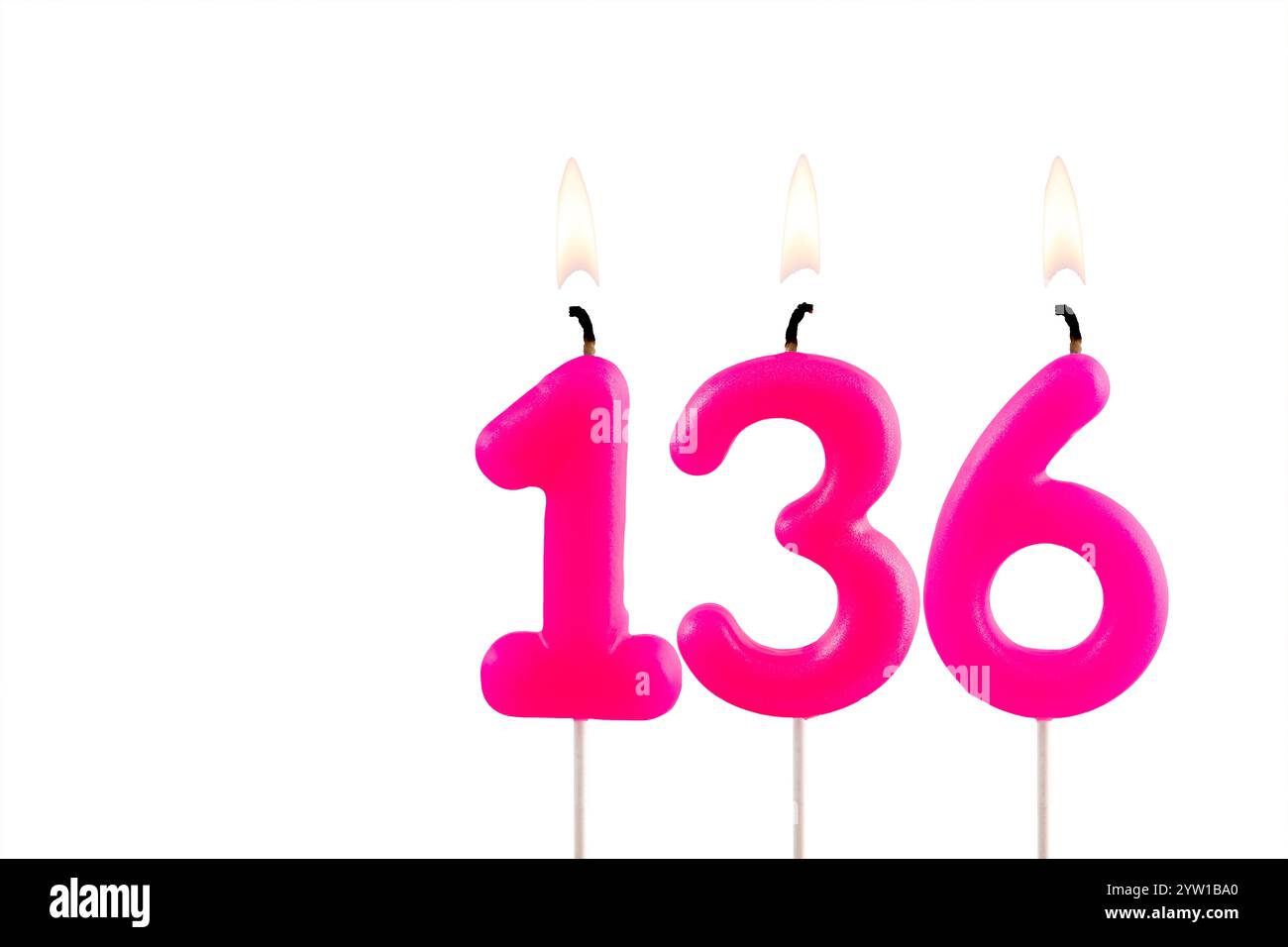 Pink number 136 birthday candle lit on white background Stock Photo - Alamy