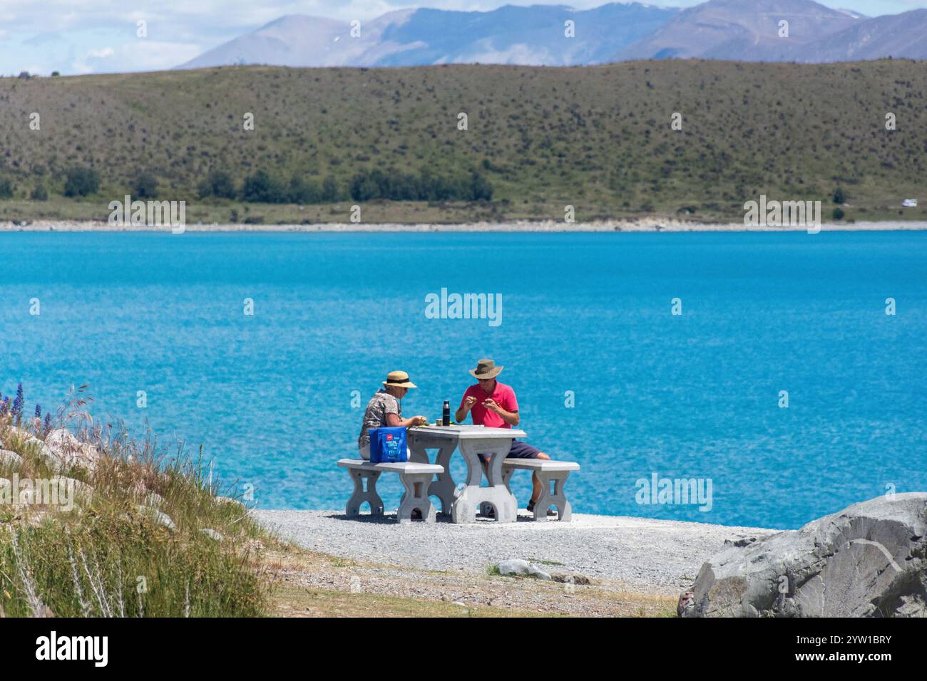 Couple dining eating by lake pukaki pukaki lake foreshore south hi-res ...