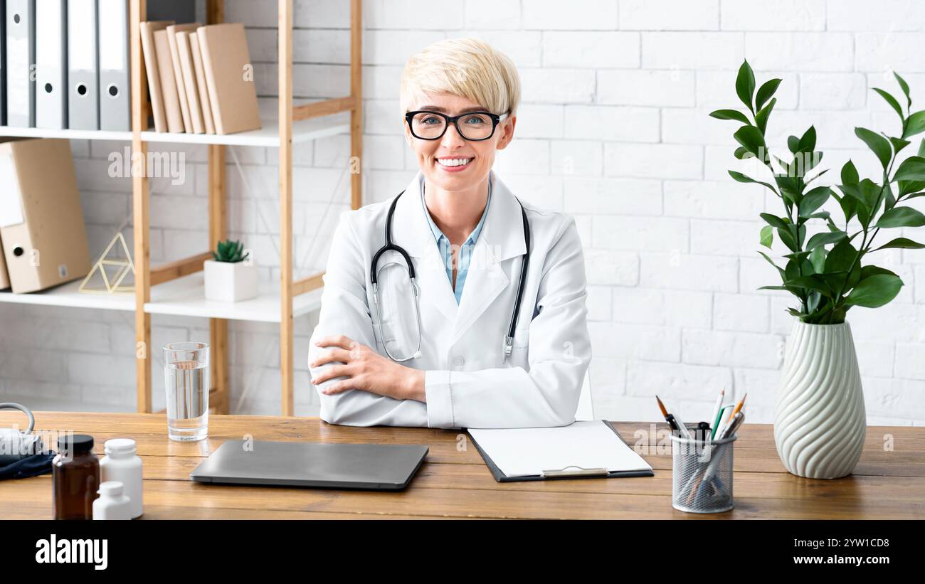 Practicing doctor concept. Woman in white coat and glasses Stock Photo ...