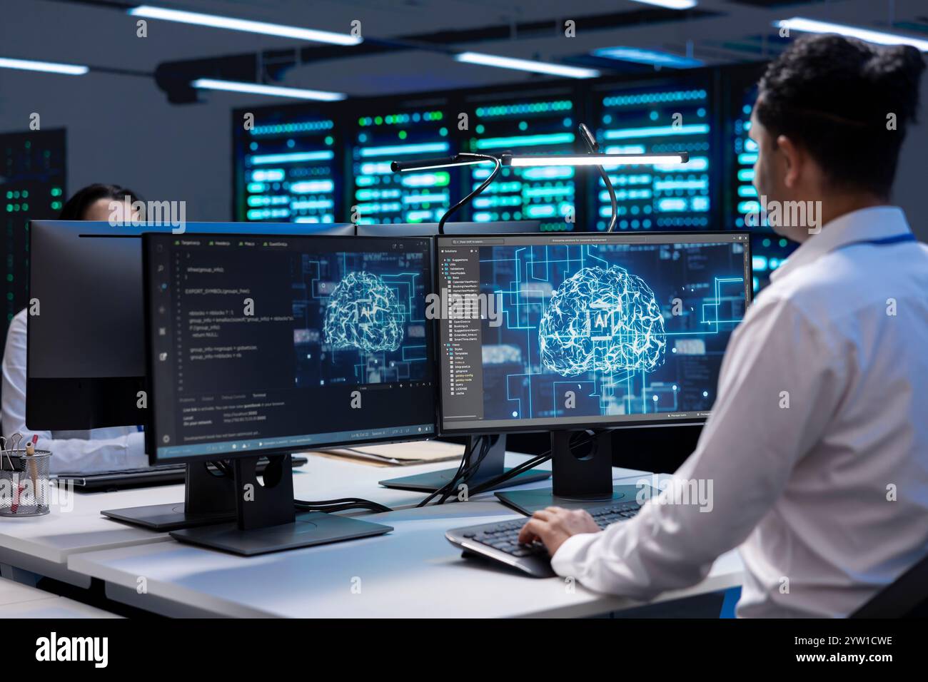 Computer scientist working in data center providing computing resources needed for artificial ...