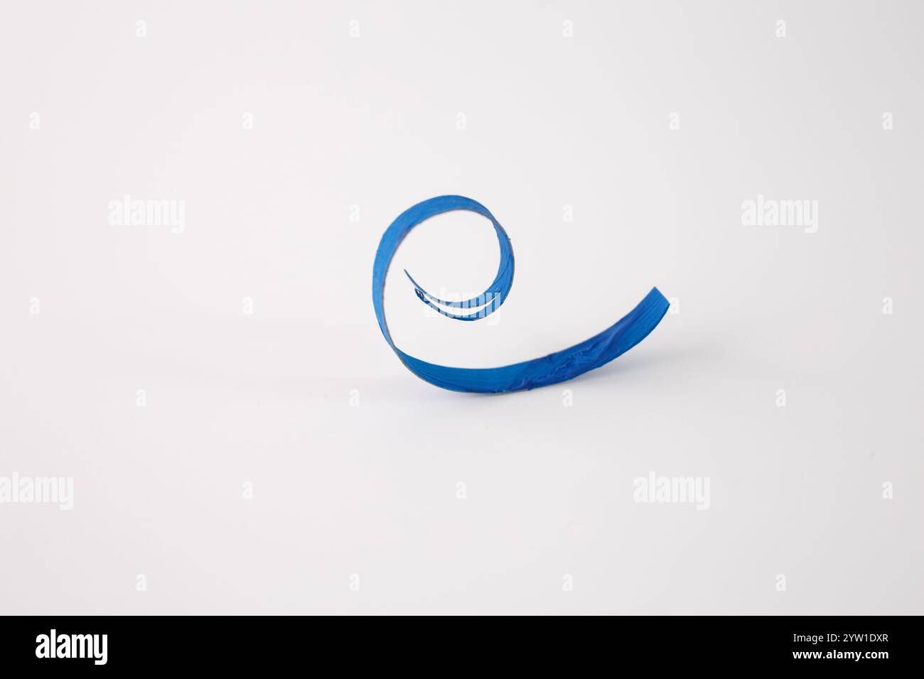 blue paper cut into specific shape, one long, curved piece. The ... blue paper cut into specific shape, one long, curved piece. The ...