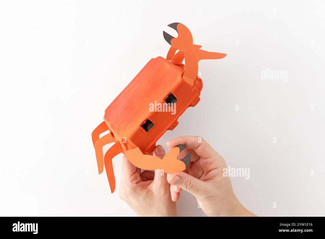 Craft project that resembles crab made from red-painted egg carton with ...