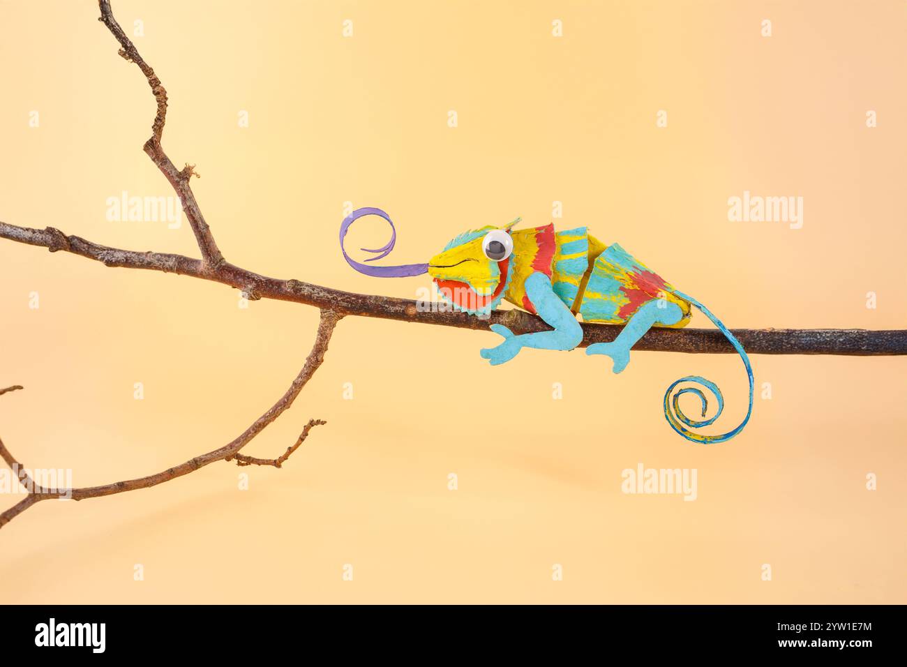 an upcycled egg box chameleon painted in bright colors, including ...