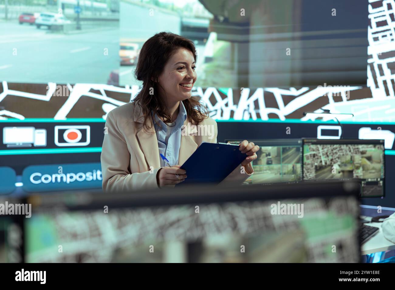 Manager gives order tracking details to her employees in control center ...