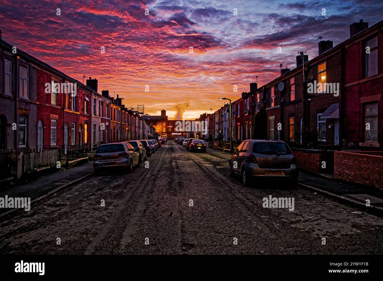 Powerful sunset along street of terraced houses, Bury, Lancashire Stock ...