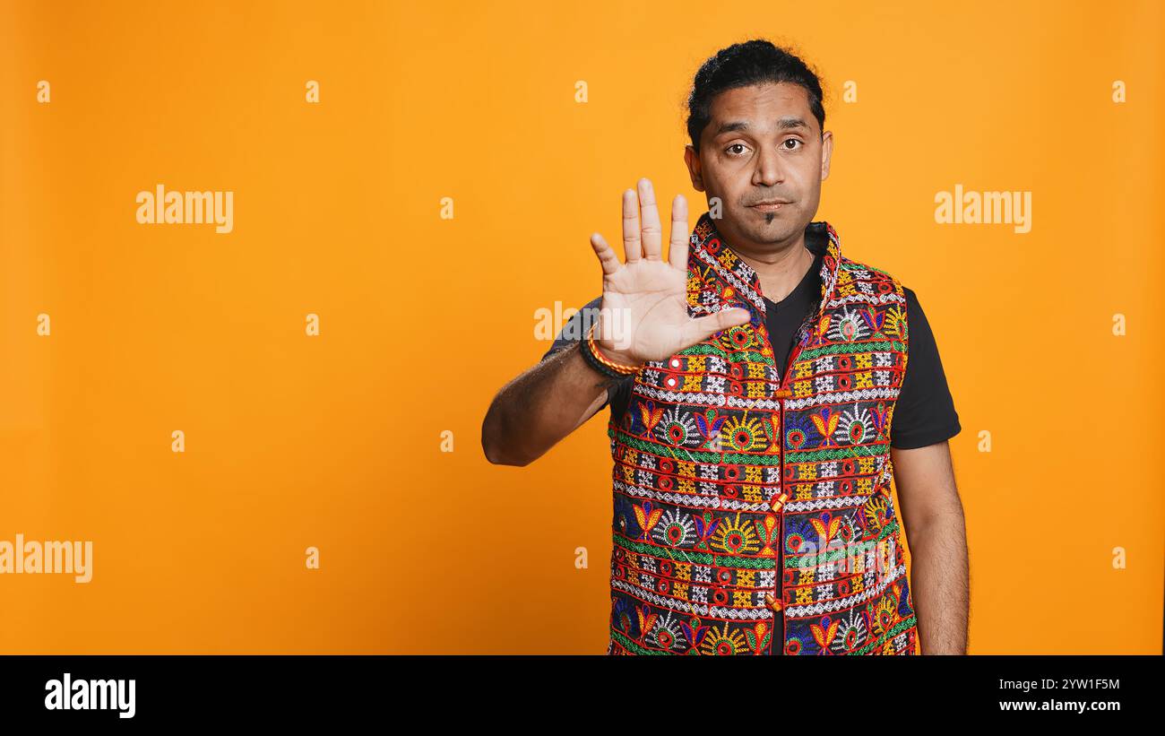 Stern indian man doing stop hand gesture sign, complaining ...