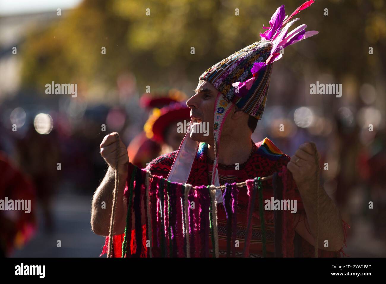 A member of a Peruvian folkloric group residing in Spain, sings during ...