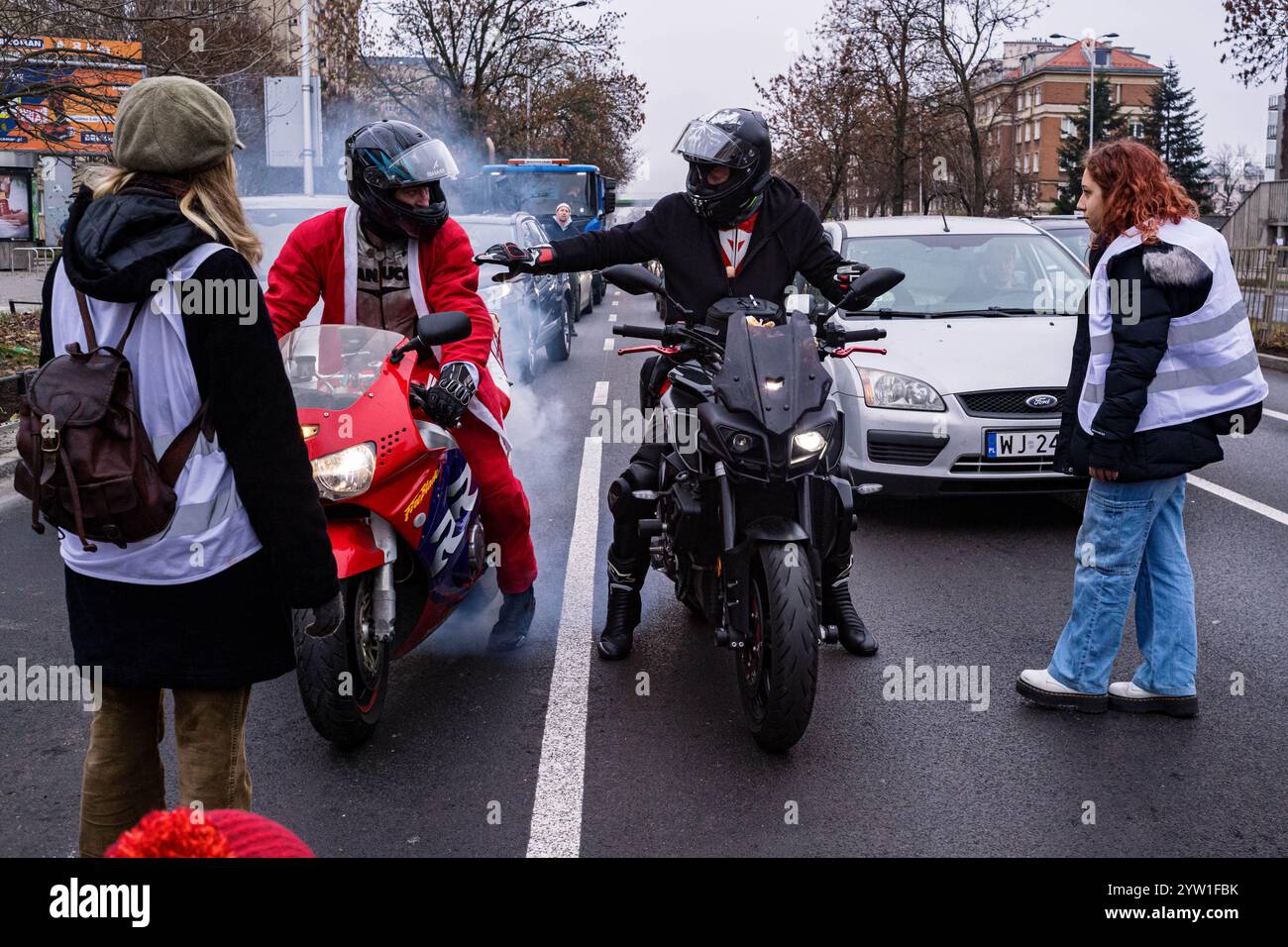 Motorcyclists are blocked from moving by the climate activists during ...