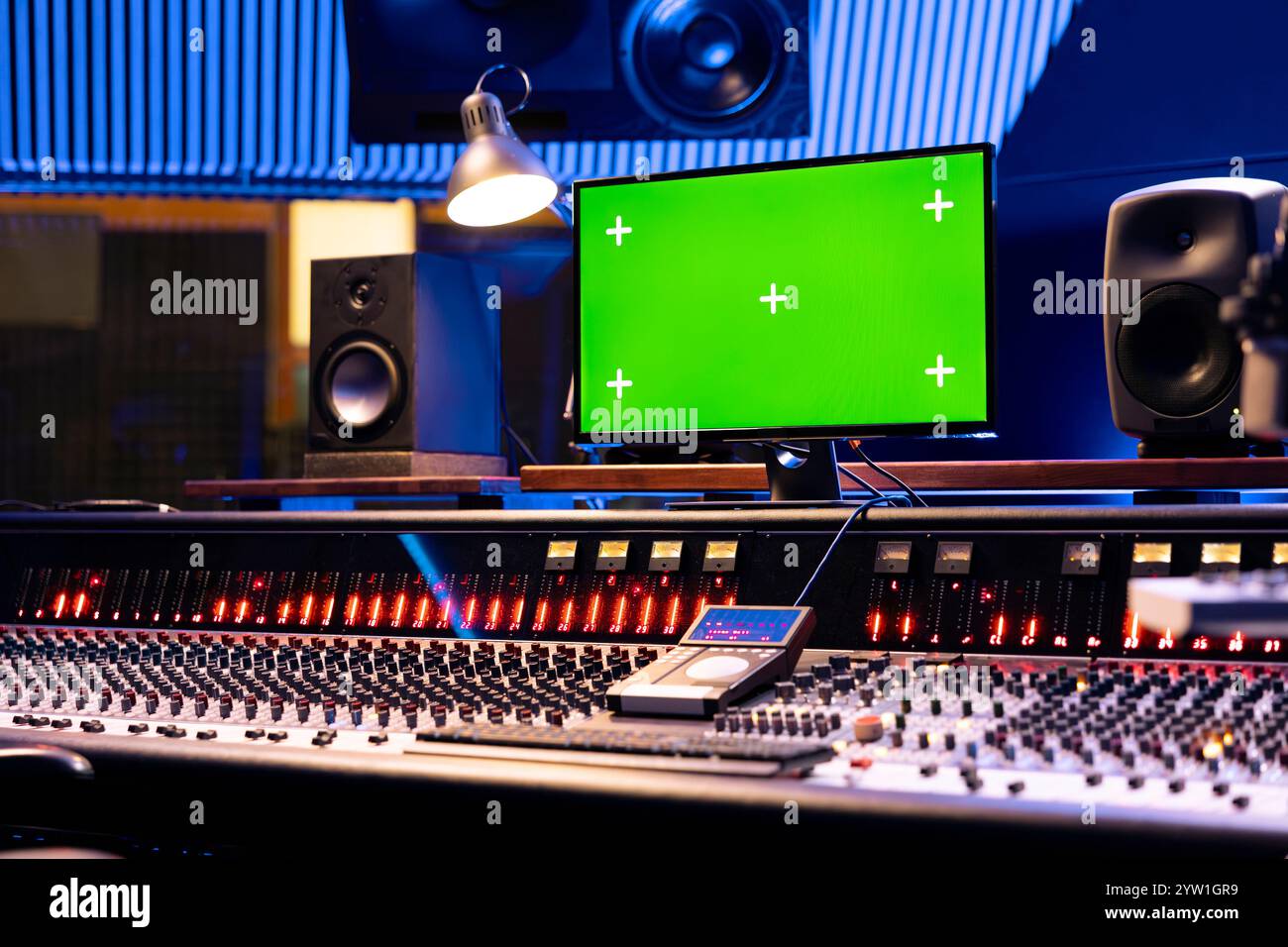 Mockup display on computer next to control desk soundboard, empty music ...