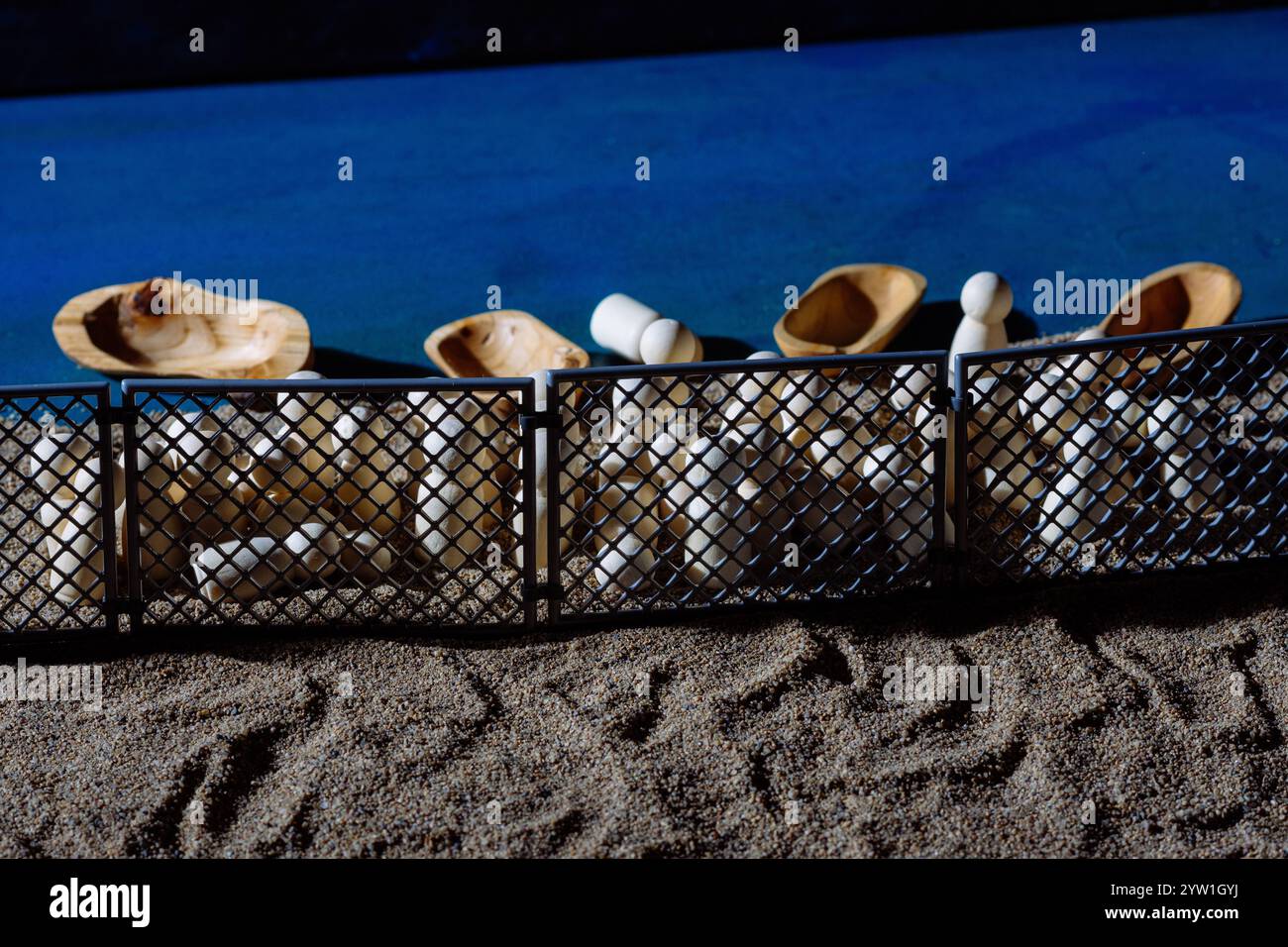 Migration Hardships Depicted in Symbolic Night Scene Stock Photo - Alamy