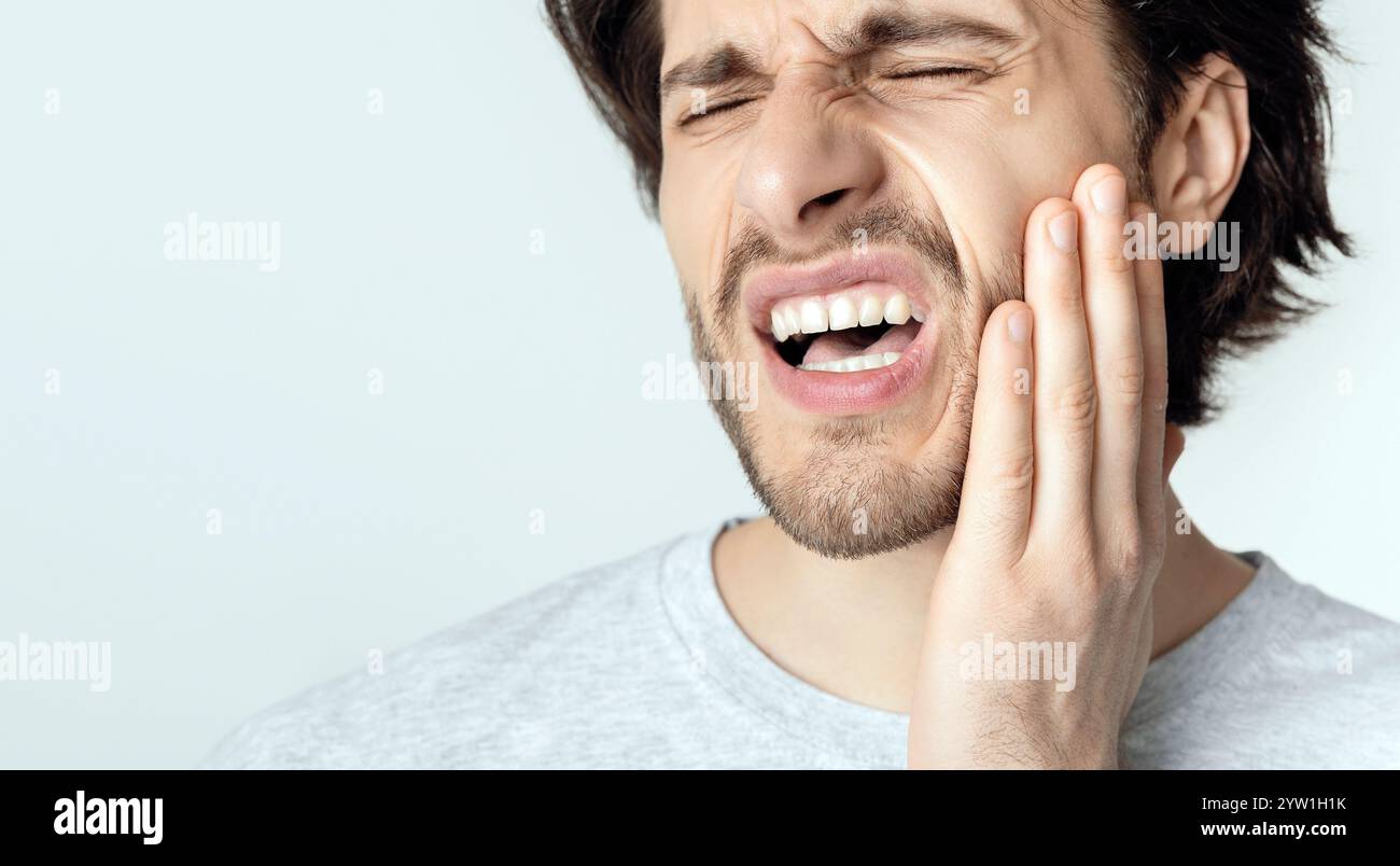 Man touches cheek hand hi-res stock photography and images - Alamy