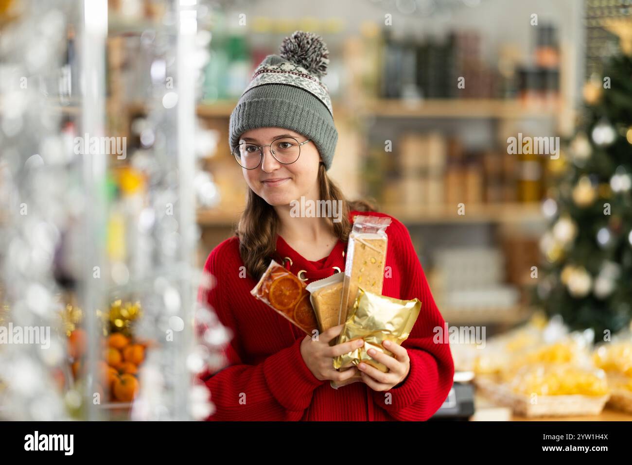 Adolescence girl customer choose consider desserts and sweet snacks ...