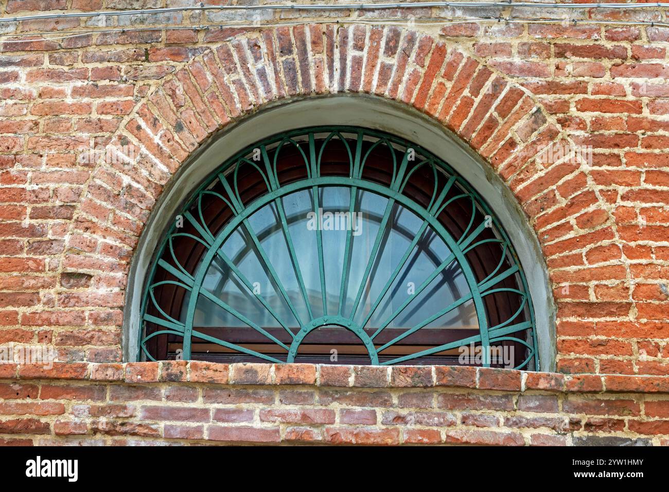 Oval window with brick wall facade on medieval Venice house Stock Photo ...