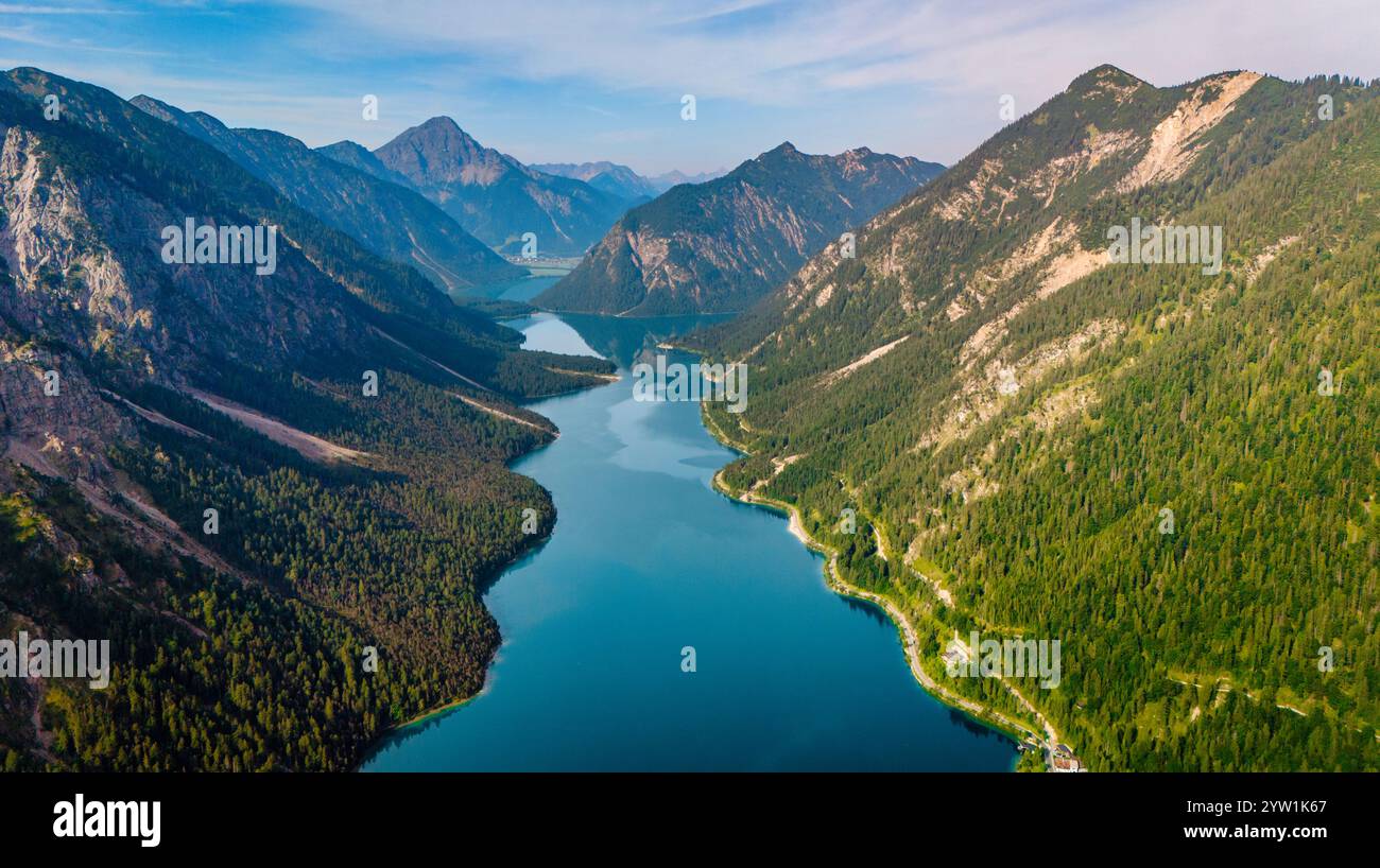 The tranquil waters of Plansee Austria reflect the surrounding ...