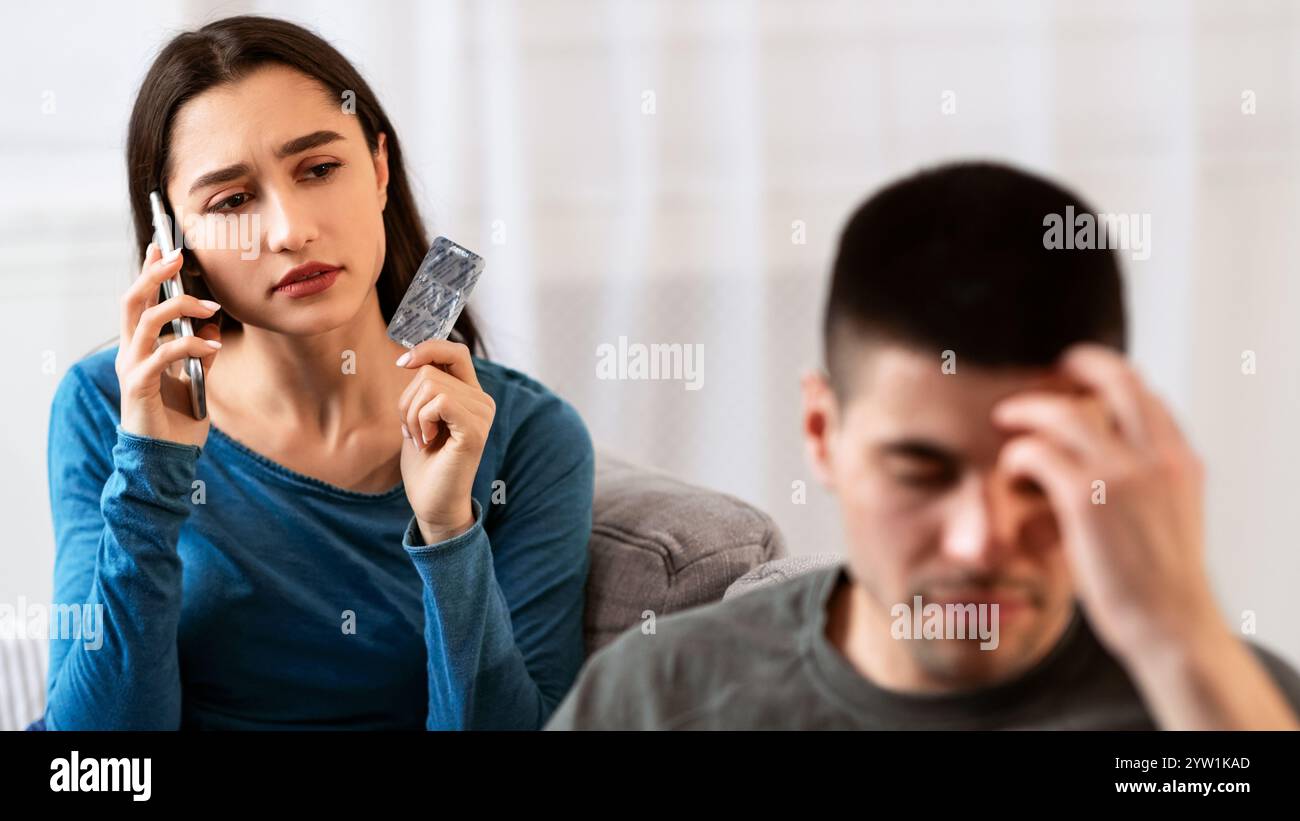 Worried wife calling doctor while her husband feeling bad Stock Photo ...