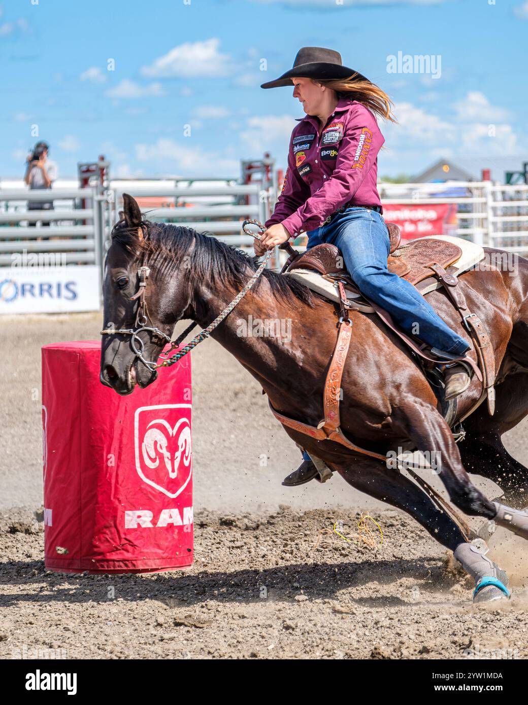 Woman rider competing in a barrel racing event Stock Photo - Alamy