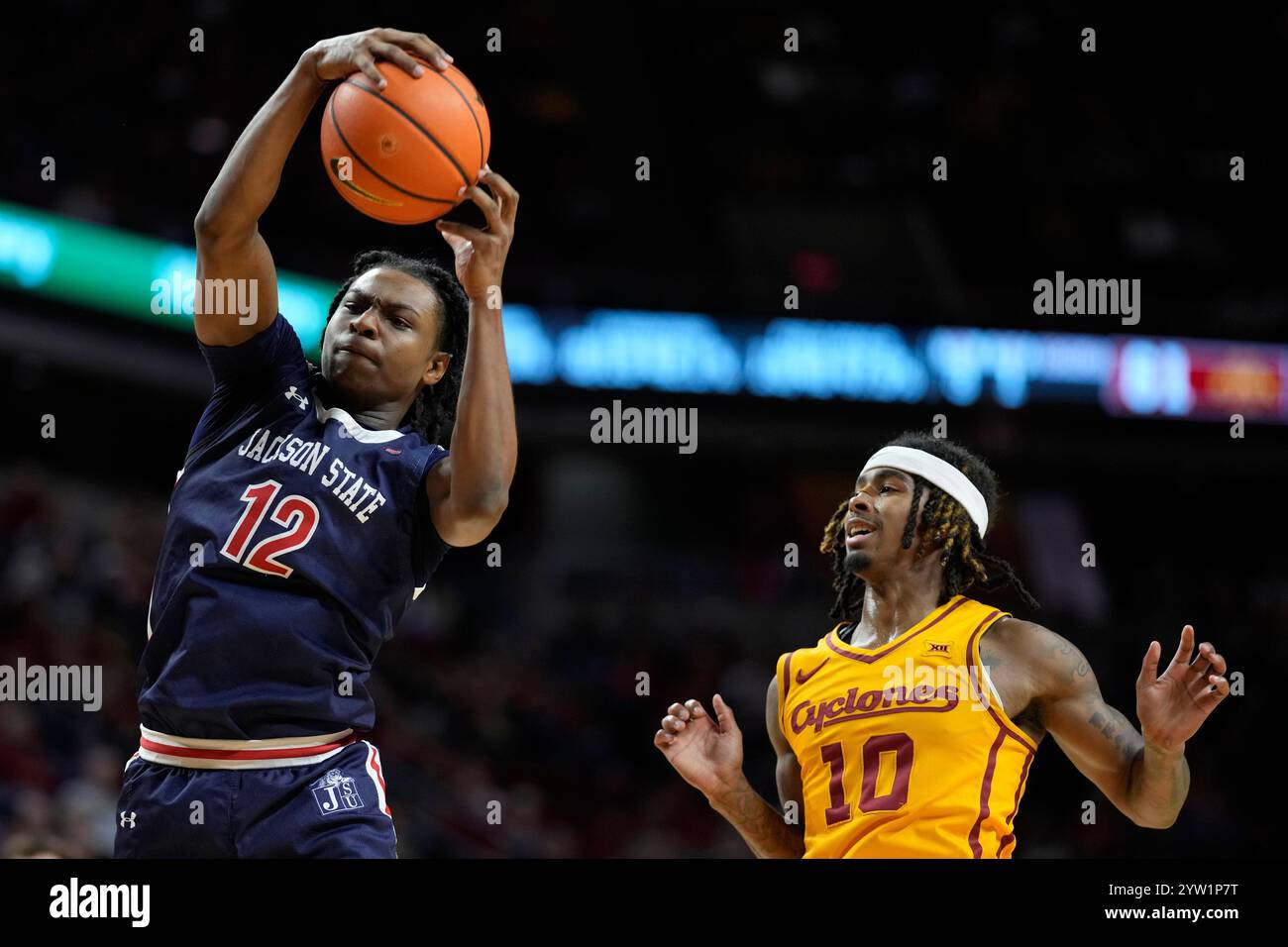 Jackson State guard Delyle Williams (12) grabs a rebound over Iowa ...