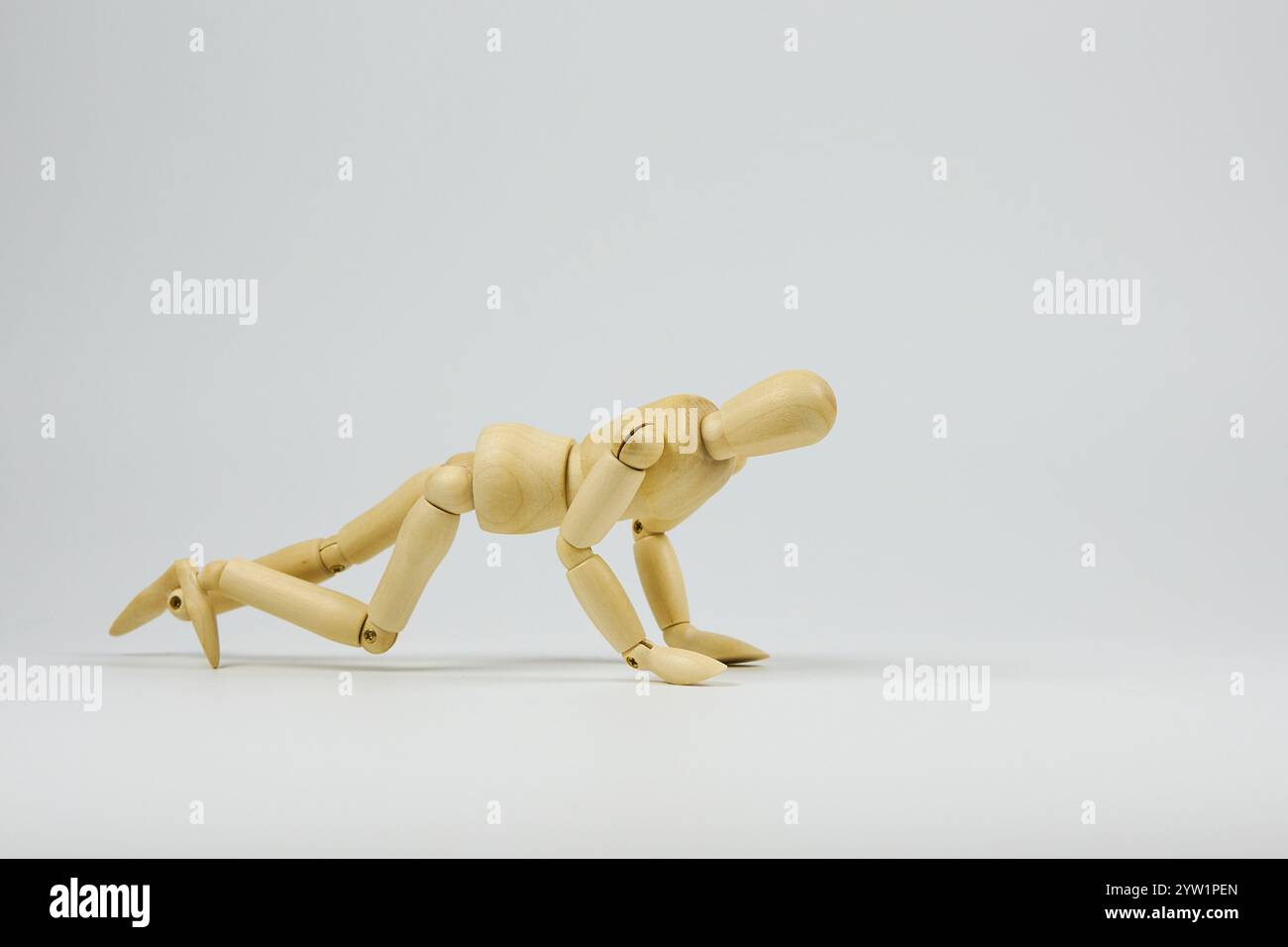 Articulated wooden figure representing the position of some type of ...