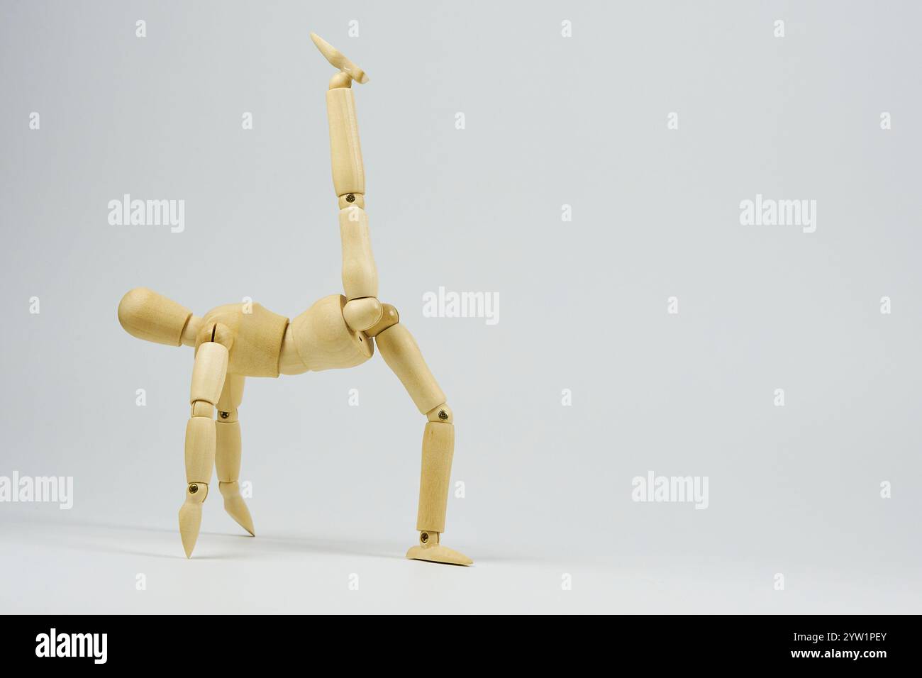 Articulated wooden figure representing the position of some type of ...