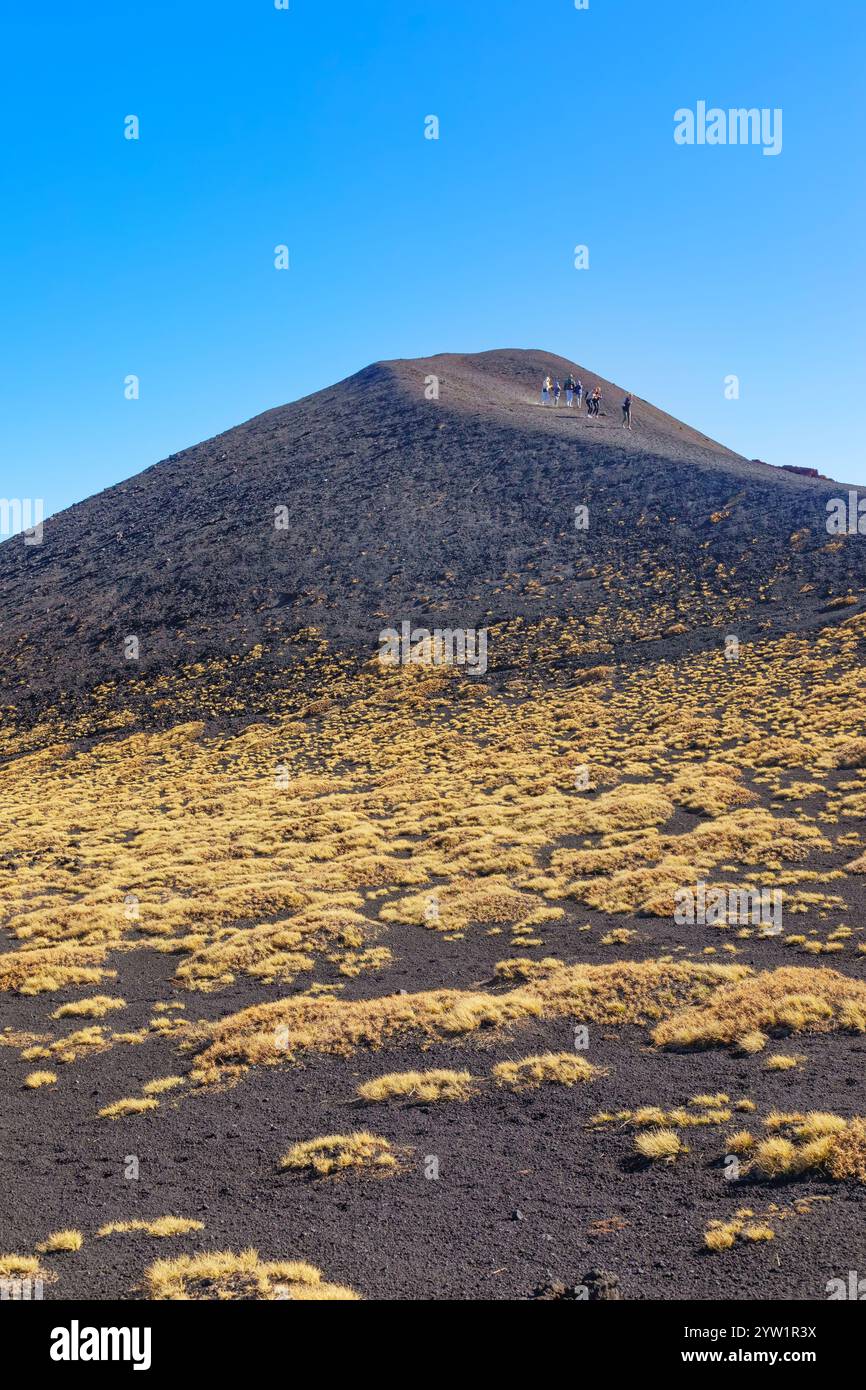 Group of hikers walking around crater rim, Etna, Sicily, Italy Stock ...