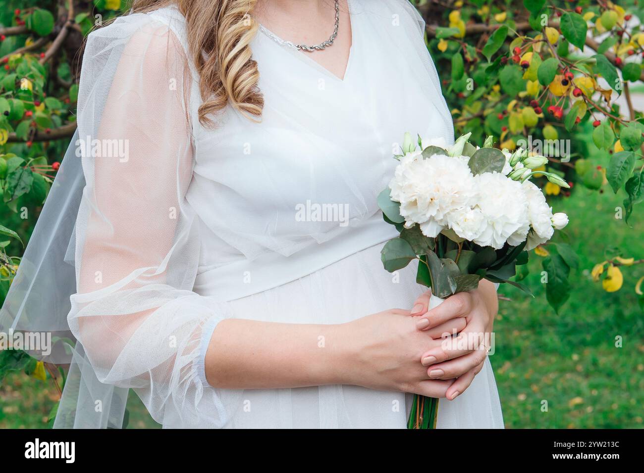 Bride holding a beautiful white wedding bouquet. Romantic moments of ...