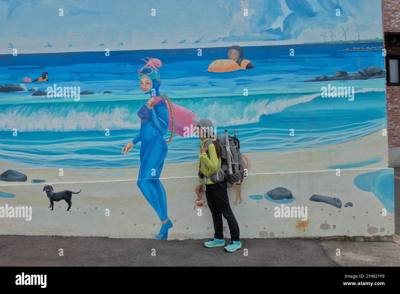 Haenyeo women diver mural along the Jeju Olle Trail, Woljeong, Jeju ...