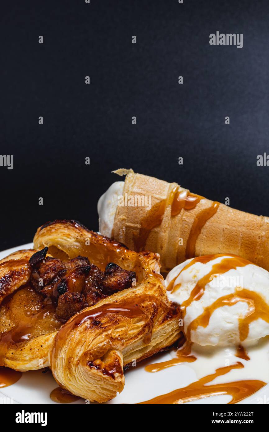 Delicate puff pastry with apples, ice cream and caramel syrup, snack ...