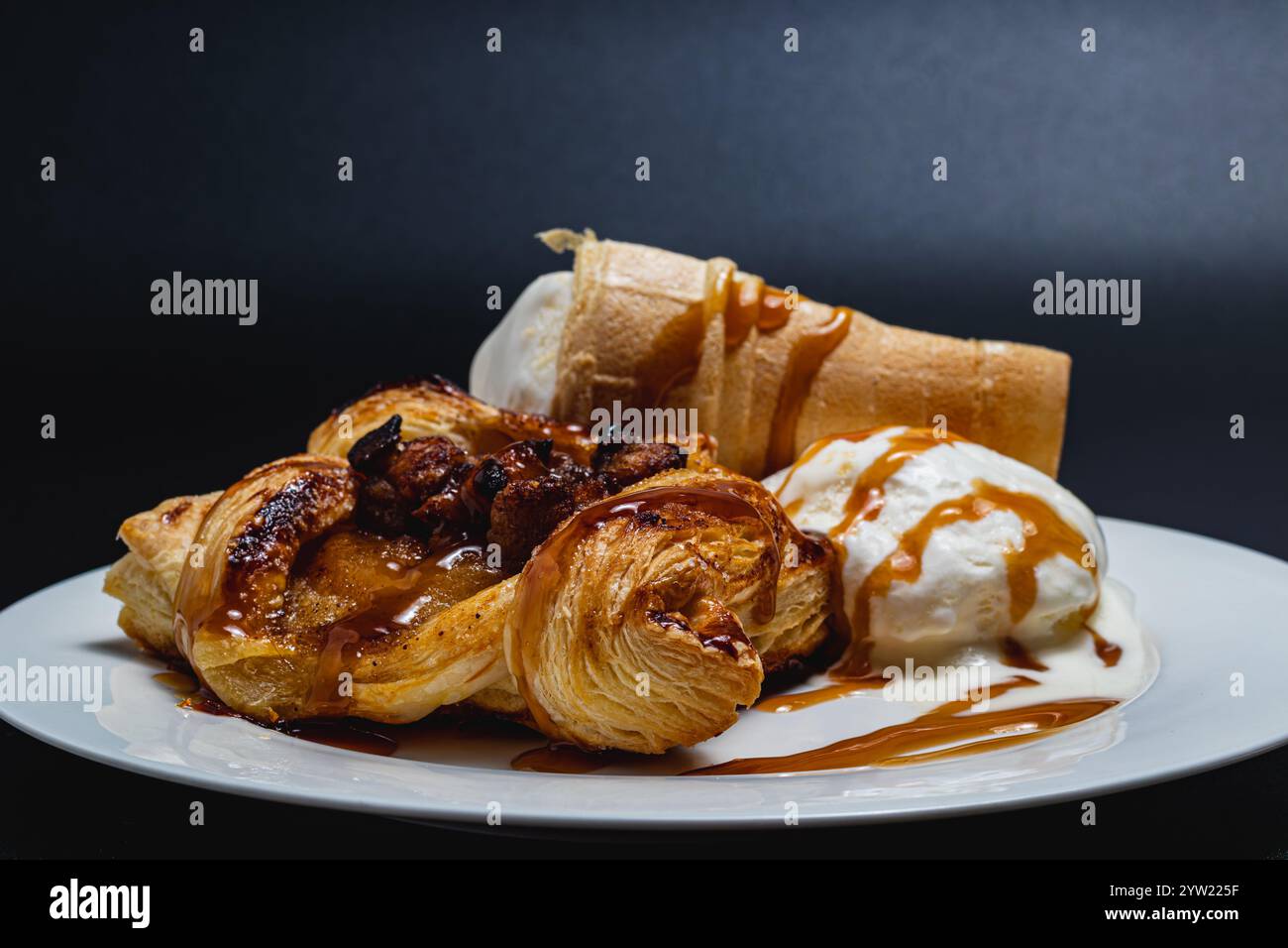 Delicate puff pastry with apples, ice cream and caramel syrup, snack ...