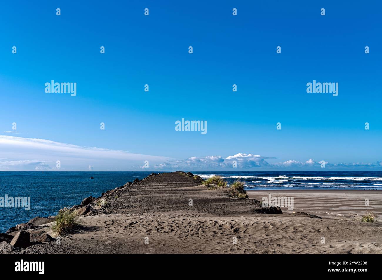 The north jetty reaches out into the Pacific Ocean at Cape ...