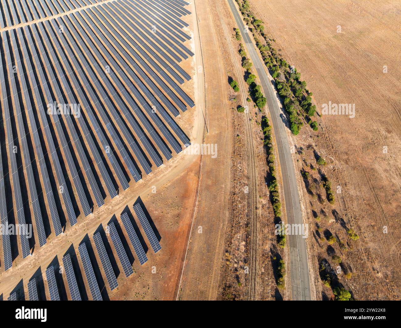 Aerial view of rows of solar panels alongside a country road at Tailem ...